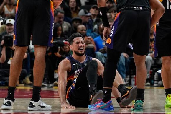 Suns All-Star guard Devin Booker to miss at least a week with sprained ankle - NewsBreak