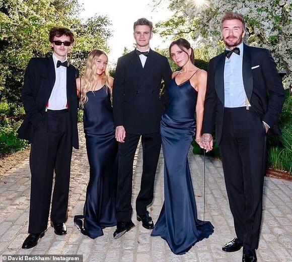 Romeo Beckham shirks family woes as he plants a kiss on girlfriend Kim ...
