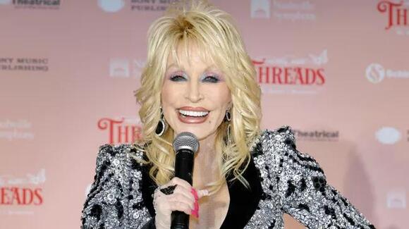 Watch: Dolly Parton Reflects On Her Dazzling 'Signature Style' - NewsBreak