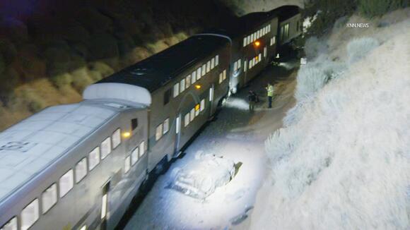 Vehicle Plummets Off Cliff, Struck by Train Below - NewsBreak