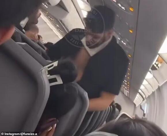 Frontier passenger, 21, seen CACKLING after mid-air brawl has smile ...