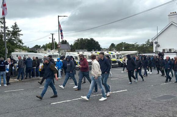 DUP MP defends photo with masked men at Scarva protest - NewsBreak