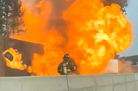 Video shows tractor-trailer gas tank exploding next to firefighters on ...
