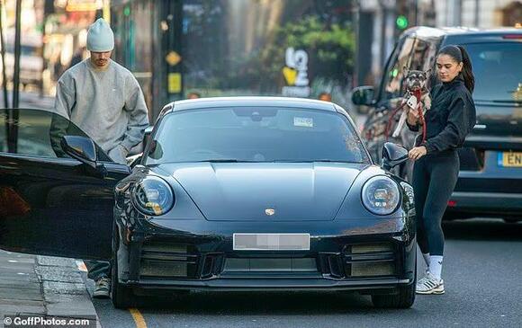 Romeo Beckham shirks family woes as he plants a kiss on girlfriend Kim ...