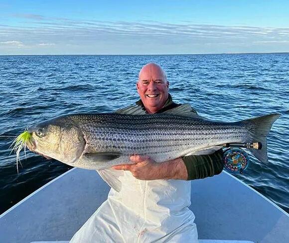 Fishing Guide Makes One Cast & Catches World Record Striped Bass On A ...