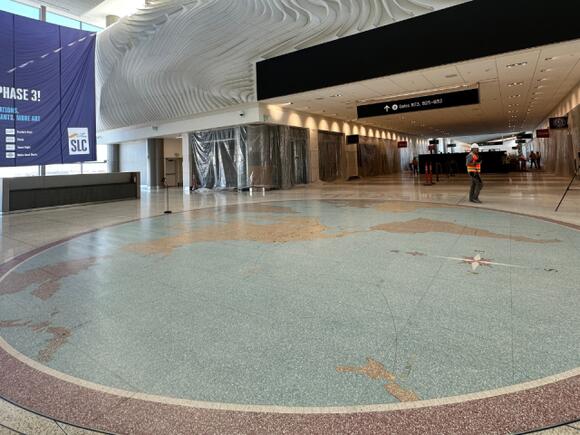 Iconic world map design salvaged from floor of old SLC Airport