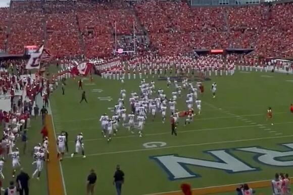 Oklahoma football player wiped out by cheerleader doing backflips on field