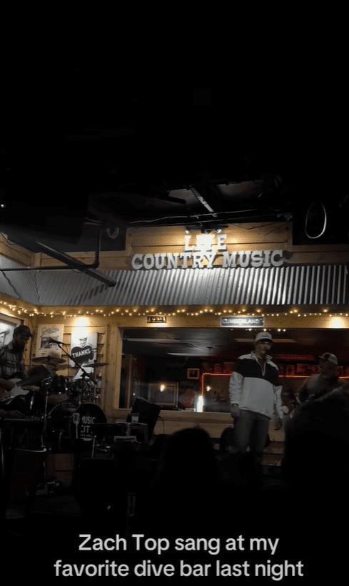 WATCH: Zach Top Covers Merle Haggard During Unexpected Dive Bar ...