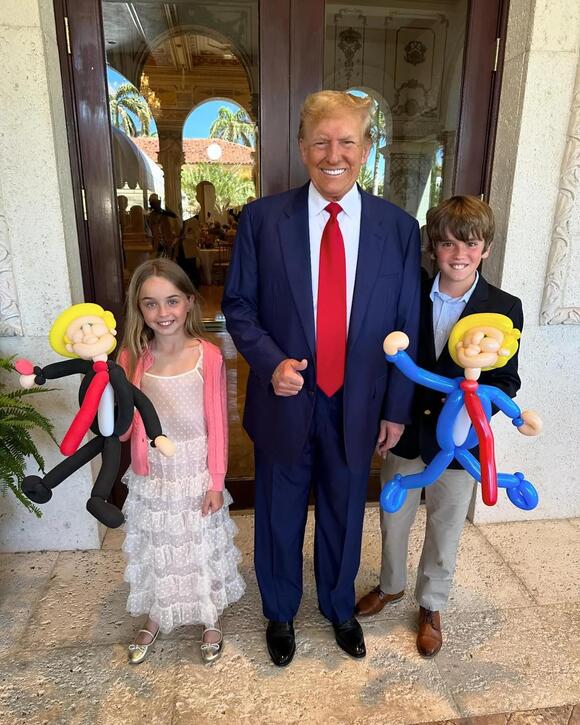 Barron Trump gives crowd thumbs up at Easter party with beaming mom ...