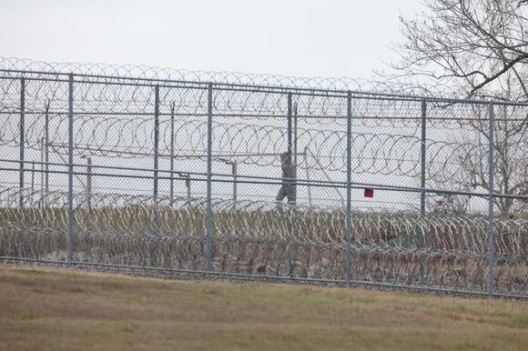 Forlorn Ghislaine Maxwell pictured pacing the yard of Florida prison ...