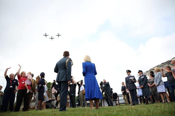 Windy welcome for Camilla as she visits allotment on air base