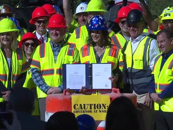 'Took all of us.' Whitmer signs long-term road funding bill in Clinton ...