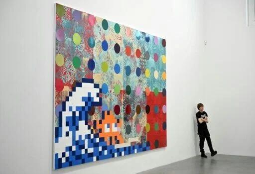 A gallery assistant stands next to the artwork 'Troubled Waters', 2025 ...