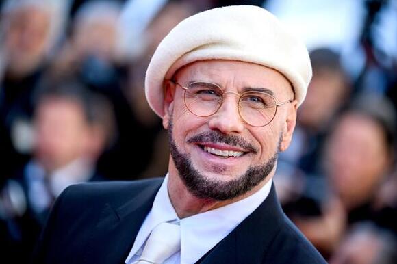 John Travolta explains bold headgear choice at Cannes amid plastic ...