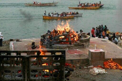 Burning funeral pyres at Harishchandra Ghat, along the banks of river ...