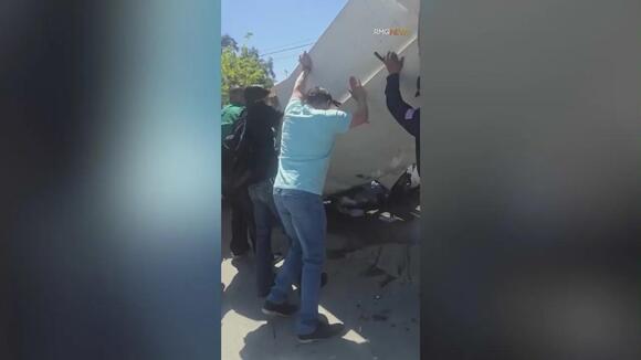 Good Samaritans lift small plane to free pilot after crash into store ...