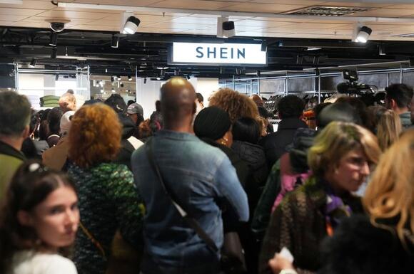Protesters carry 'Shame on Shein' signs as fast fashion brand opens ...