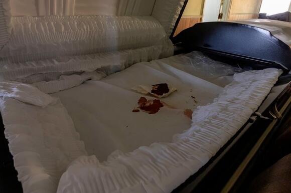 Eerie images of abandoned funeral home show caskets covered in dried ...