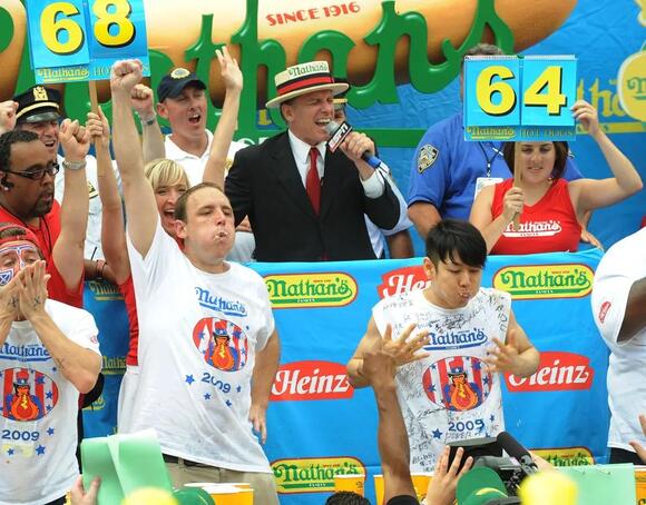 Joey Chestnut wins $100,000 after smashing world record with 83 hot ...