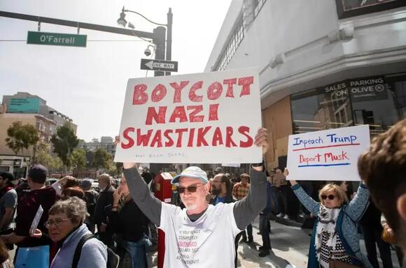 Hundreds protest Tesla showrooms over Musk’s DOGE work - NewsBreak