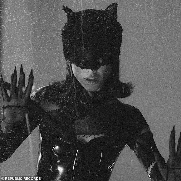 Ariana Grande transforms into Catwoman to stalk You's Penn Badgley in ...