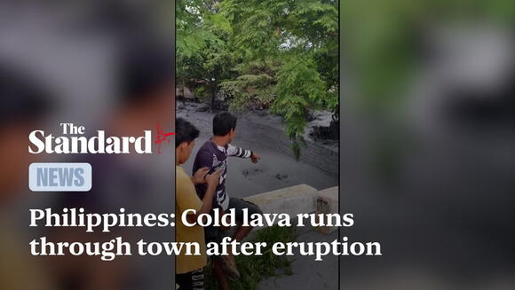 Watch as cold lava flows through a Philippines town - NewsBreak