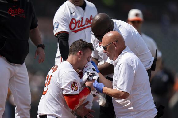 Orioles catcher James McCann shrugs off fastball to face, stays in game ...