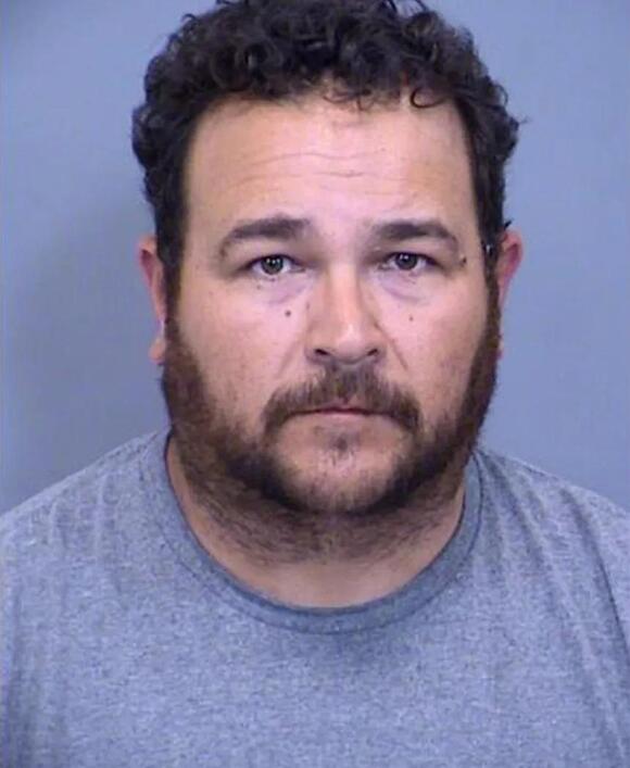 Arizona teacher Eric Curtis Chapman smirks in court after being accused of sex crimes against ...