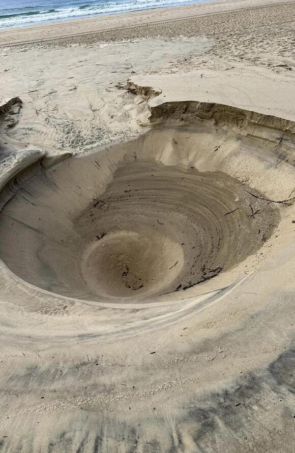 Mysterious hole opens up on Australian beach