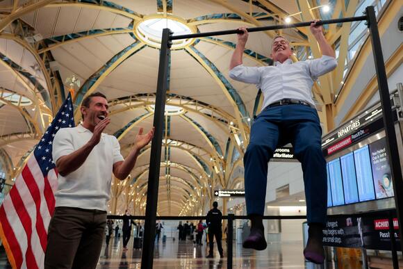 RFK Jr and Trump official do pull-ups in bizarre airport press ...