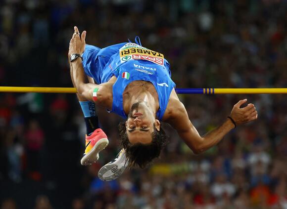 Italian Olympian breaks high-jump record before faking injury, jokingly ...