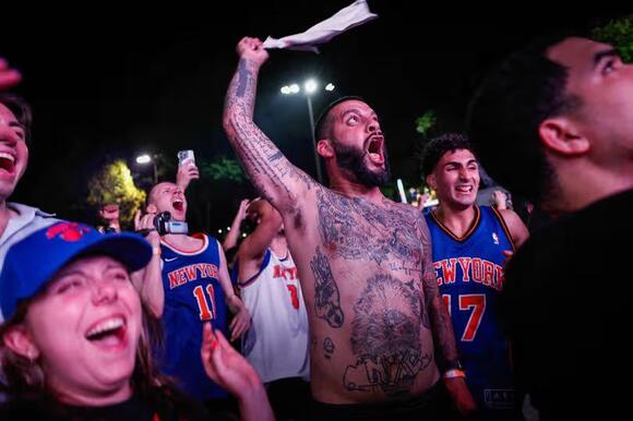 Riot police chase Knicks fans who smash up NYPD car as New York ...