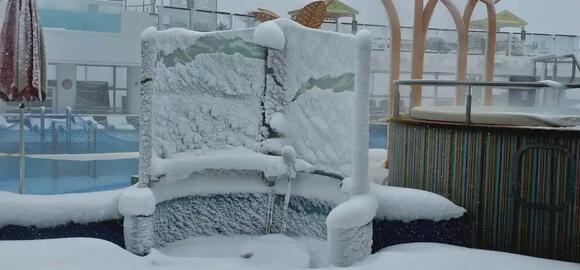 Photos show Royal Caribbean cruise ship blanketed by snow in major ...