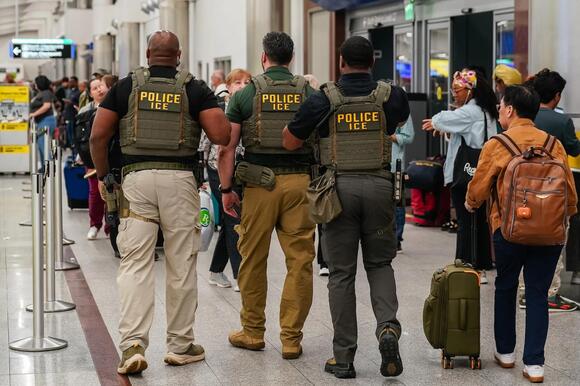 Federal immigration agents filmed making airport arrests as Trump calls ...
