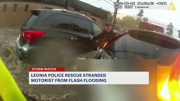 WATCH: Leonia police officers rescue motorist stranded in flooding ...
