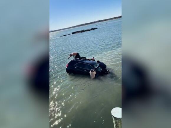 Video shows daring rescue woman drives into the water off Shore Drive ...