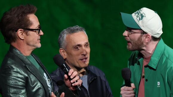 Robert Downey Jr. Makes a Tony Stark Entrance, Faces off With Chris ...