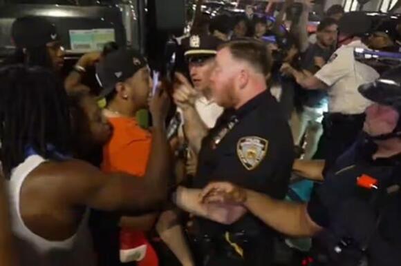 Riot police chase Knicks fans who smash up NYPD car as New York ...