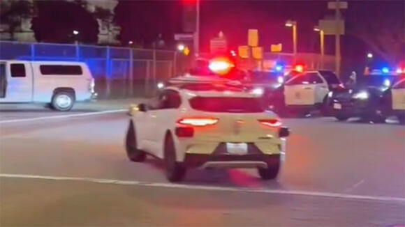 Robotaxi Rolls Through LAPD Crime Scene As Suspect Is Held At Gunpoint ...