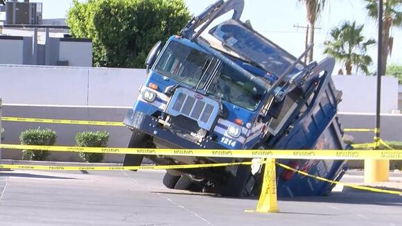 Waste truck falls into sink hole in Yuma - NewsBreak