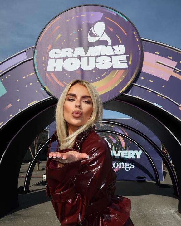 Singer-Songwriter Tallia Storm Rocks Bold Burgundy Suit at Grammy House ...