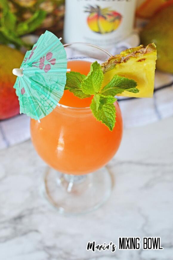 This Tropical Pineapple Mango Rum Punch Recipe Is Summer in a Glass ...