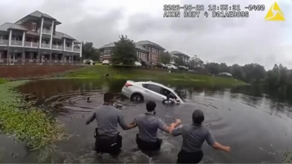 Rescuers Form Human Chain to Save Driver Trapped in Flood - NewsBreak
