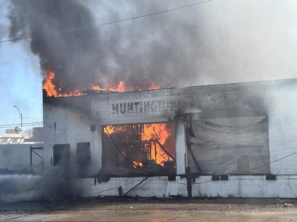 Two-alarm warehouse fire sends black smoke visible for miles near ...