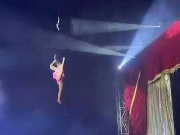 Circus acrobat crashes to ground in terrifying 'hair hanging' act as ...