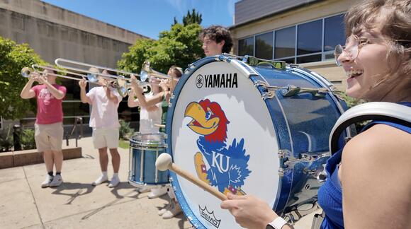 KU marching band gives Algeria's soccer team musical welcome for World ...