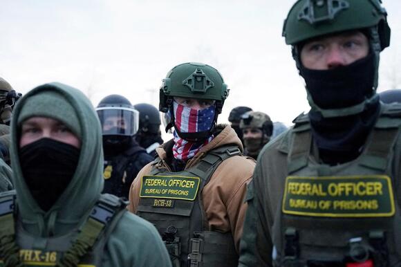 ‘How do you sleep?’ Federal agents heckled as they arrest crying ...