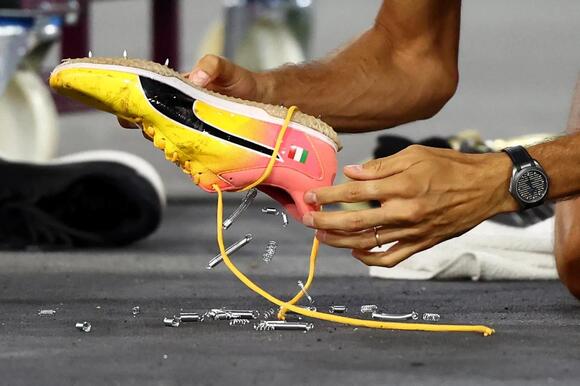 Italian Olympian breaks high-jump record before faking injury, jokingly ...
