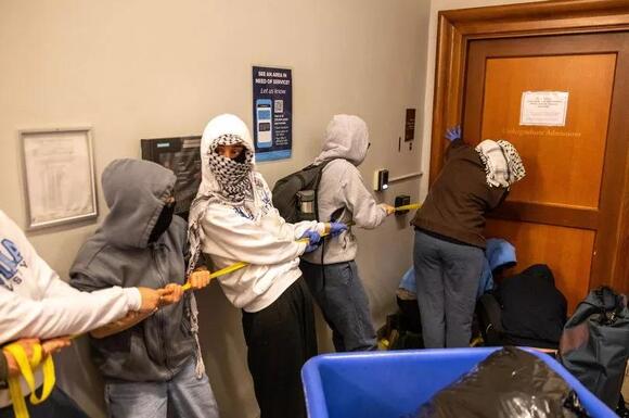 Columbia University suspends students as masked protesters take over ...