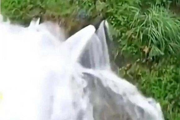 China's famous plunging waterfall appears to flow from man-made pipe ...